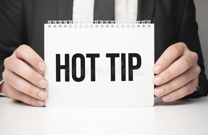 Businessman Holding Sheet of Paper with a Message Hot Tip Stock Image ...