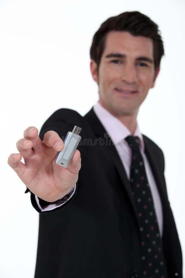 Businessman Holding a USB Key. Stock Image - Image of casual, point ...