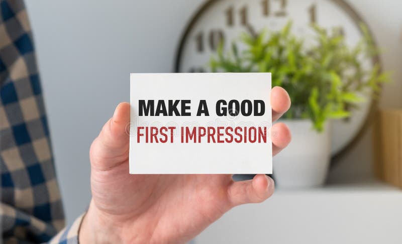 Businessman Holding a White Card with Text Make a Good First Impression ...