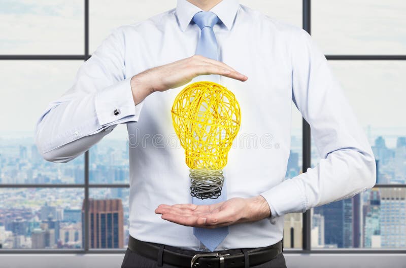 Businessman Holding Yellow Bulb Stock Photo - Image of energy, creative ...