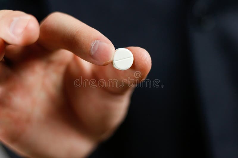 Businessman Holds One Round Tablet with Two Fingers Stock Photo - Image ...