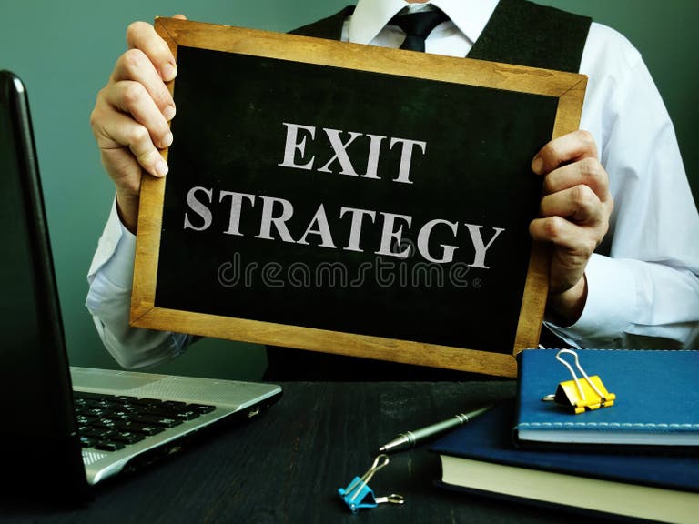 Businessman Holds Sign Exit Strategy for Business Stock Photo - Image ...