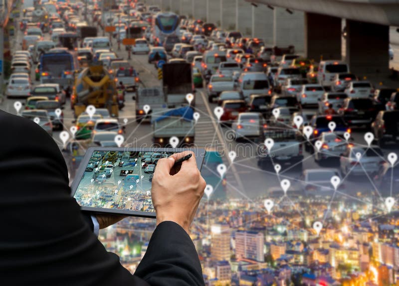 Businessman Holds a Tablet Car on the Road Network Technology of ...