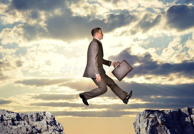 Businessman Hopping Over Abyss Stock Photos - Free & Royalty-Free Stock ...
