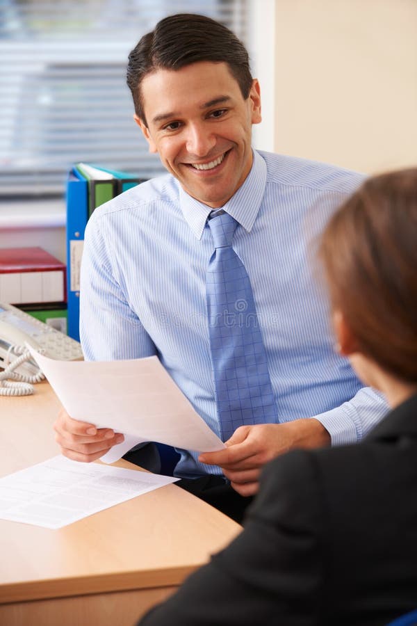 Businessman Interviewing Female Job Applicant Stock Image - Image of ...
