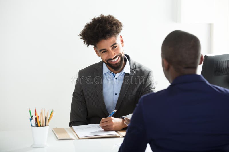 Businessman Interviewing a Businesswoman Stock Photo - Image of ...