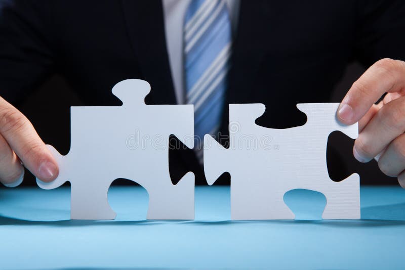 Joining two puzzle pieces stock image. Image of successful - 13405903