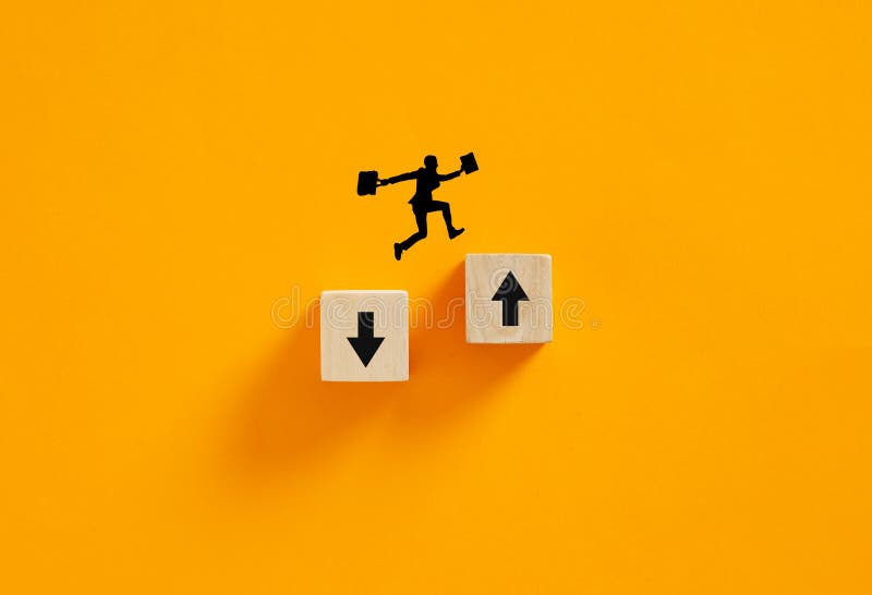 Businessman Jumping from Decrease To Increase Arrow on Wooden Blocks ...