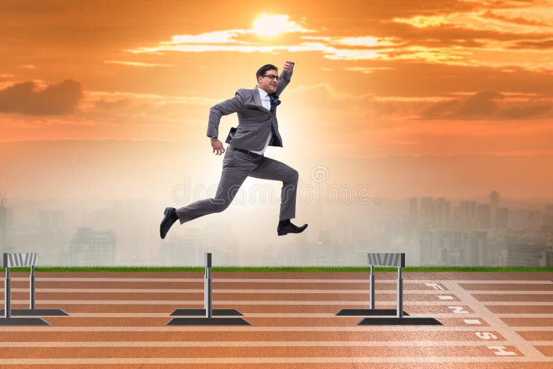 The Businessman Jumping Over Barriers in Business Concept Stock Photo ...