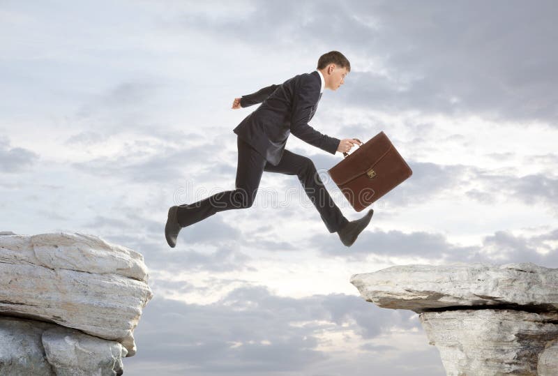 Businessman Jumping Over Rocks Stock Photo - Image of freedom, excited ...