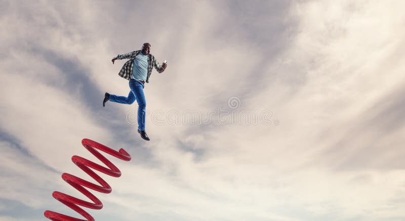Businessman Jumping on Springboard . Mixed Media Stock Photo - Image of ...