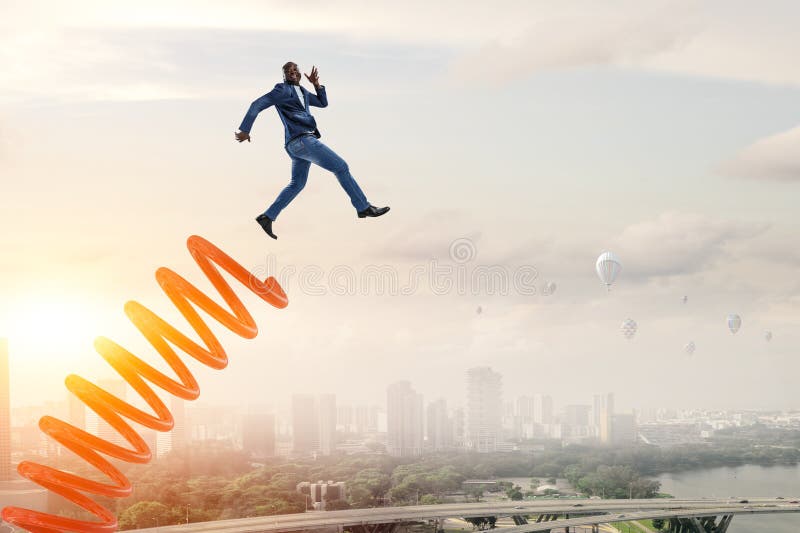 Businessman Jumping on Springboard . Mixed Media Stock Image - Image of ...