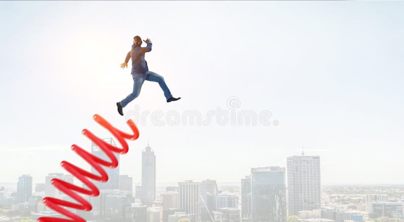 Businessman Jumping on Springboard . Mixed Media Stock Image - Image of ...