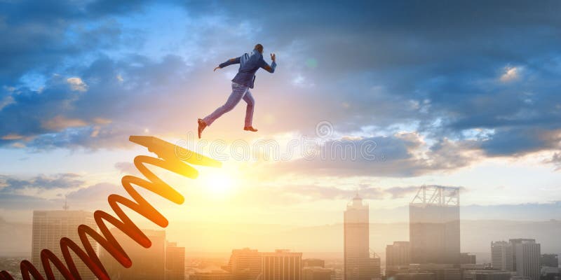 Businessman Jumping on Springboard . Mixed Media Stock Photo - Image of ...