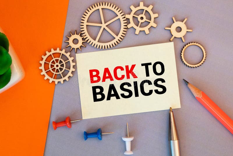 The Businessman Keeps a Card with the Text BACK TO BASICS Stock Photo ...