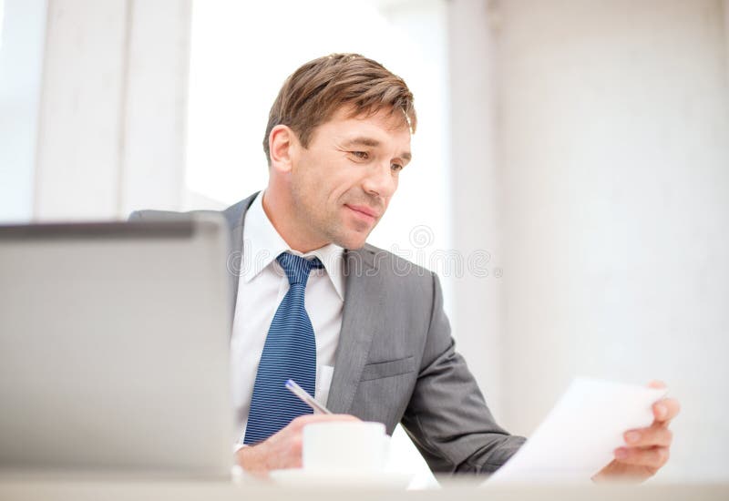 Businessman with Laptop Computer and Documents Stock Photo - Image of ...