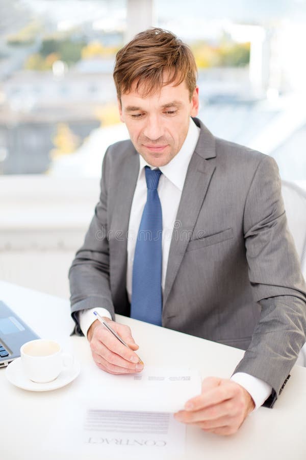 Businessman with Laptop Computer and Documents Stock Photo - Image of ...