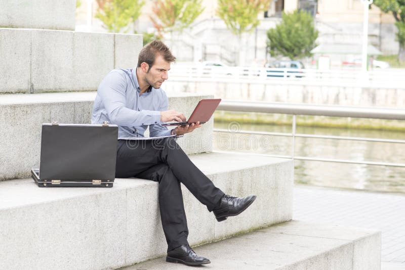 Businessman Laptop Computer in the Street. Stock Image - Image of ...