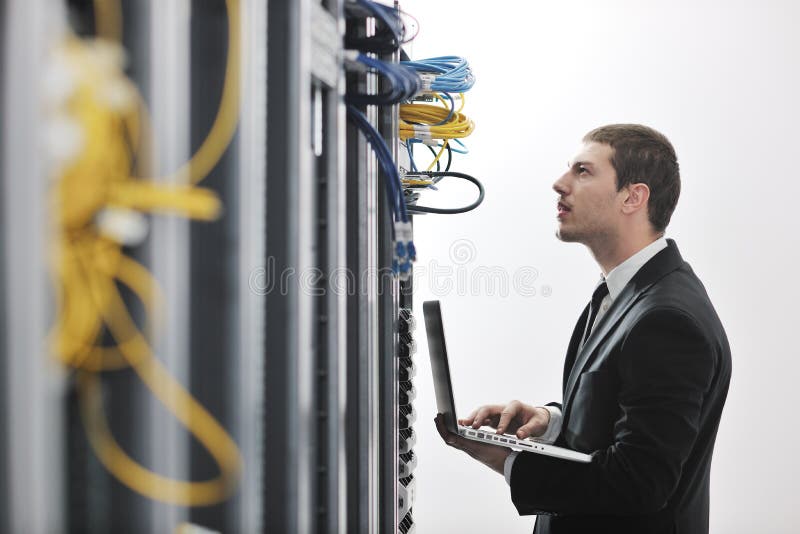 Businessman with Laptop in Network Server Room Stock Photo - Image of ...