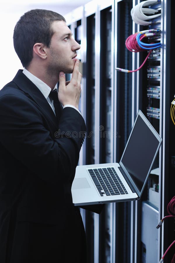 Businessman with Laptop in Network Server Room Stock Image - Image of ...