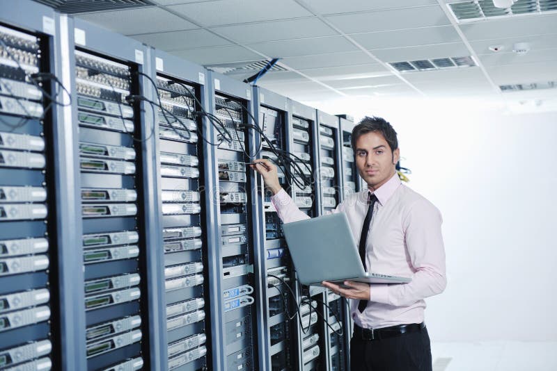 Businessman with Laptop in Network Server Room Stock Photo - Image of ...