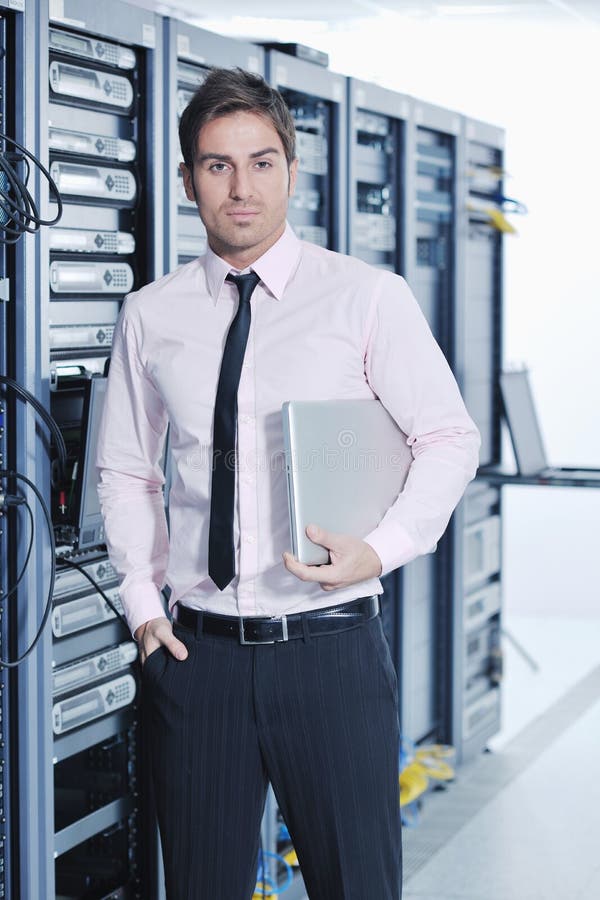 Businessman with Laptop in Network Server Room Stock Image - Image of ...