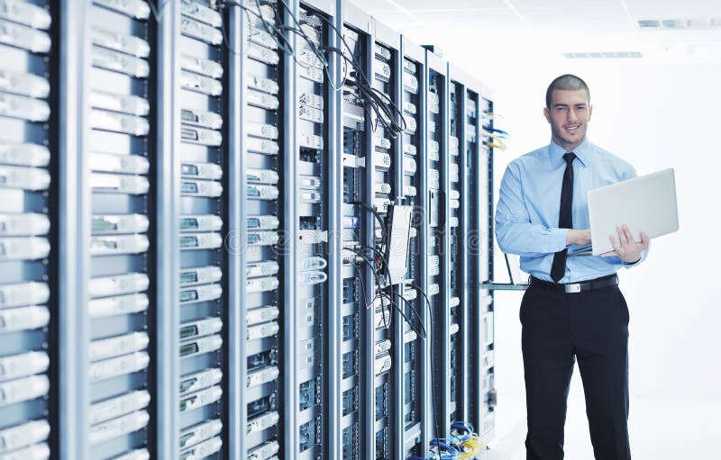 Businessman with Laptop in Network Server Room Stock Image - Image of ...