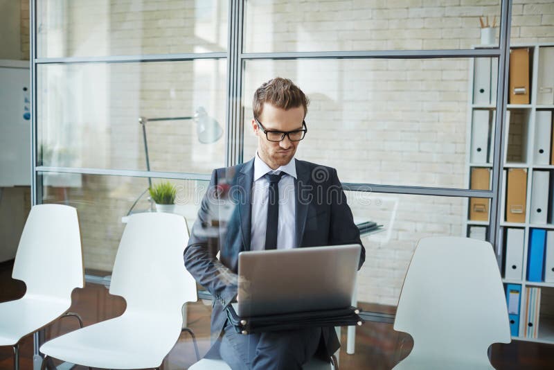 Businessman with laptop stock image. Image of young, corporate - 76282639