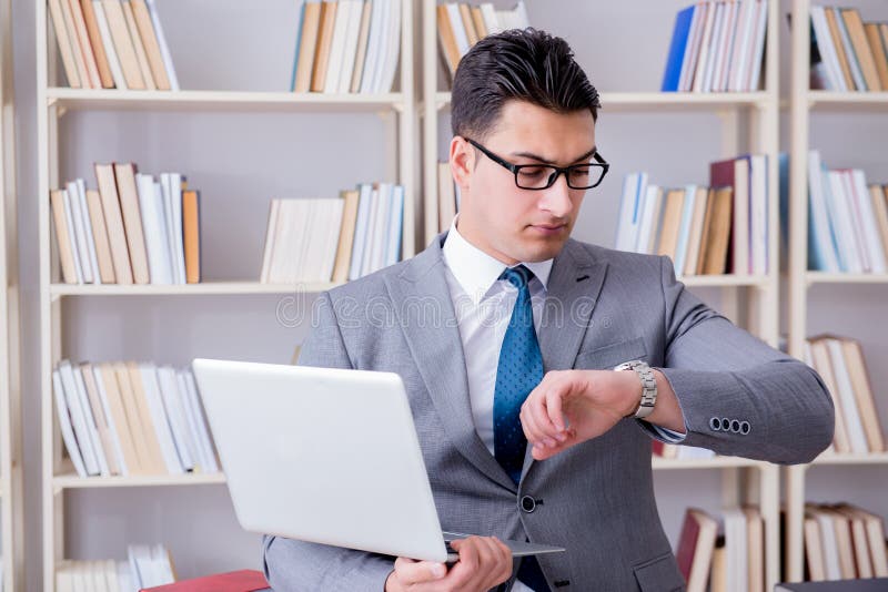 The Businessman with a Laptop Working in the Library Stock Photo ...
