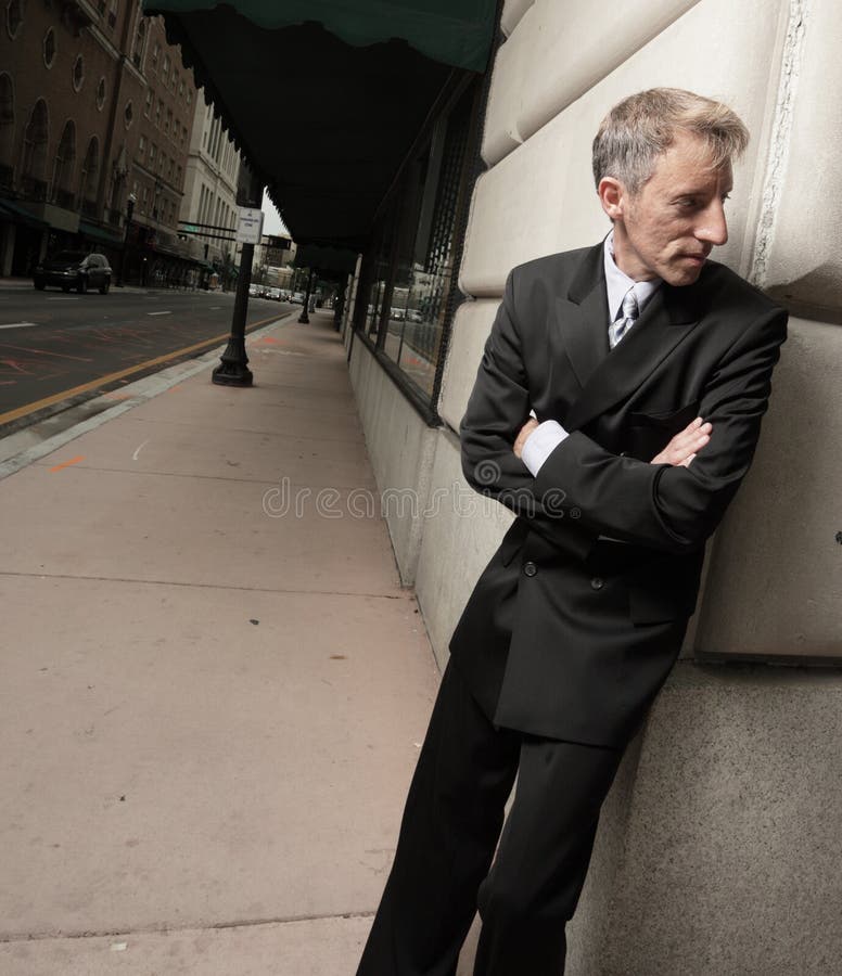 Man leaning over the ledge stock photo. Image of looking - 22304894