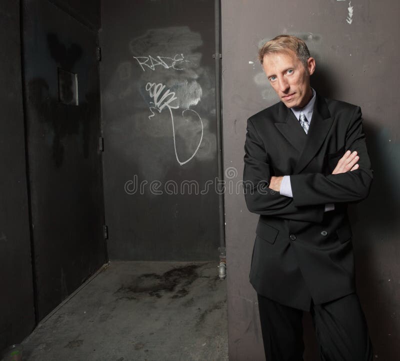 Businessman Leaning on a Wall at Night Stock Photo - Image of sixties ...