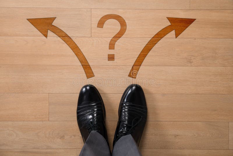 Businessman with Left or Right Arrows and Question Mark Stock Image ...