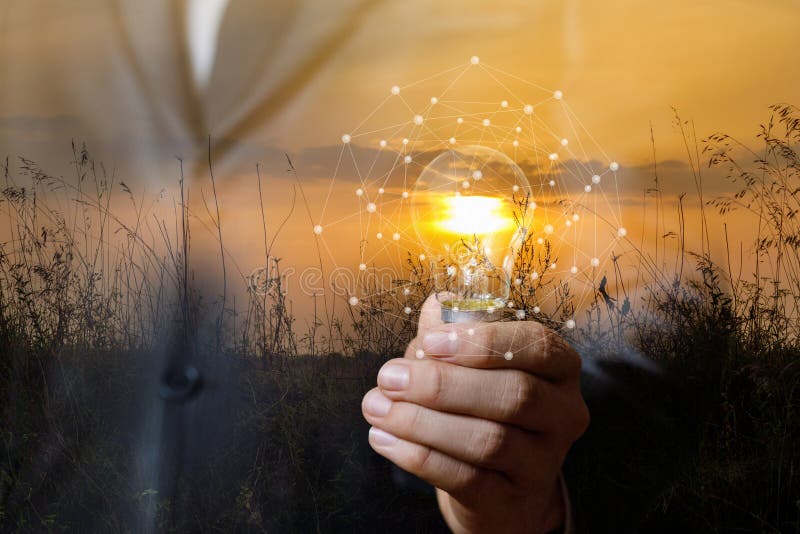 Light Bulb with Brain Inside the Hands of the Businessman. Stock Photo ...