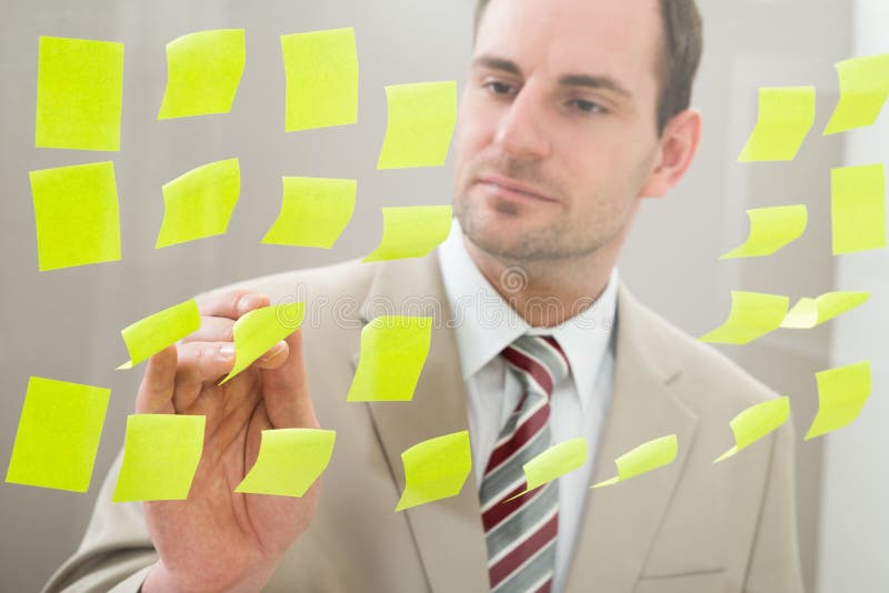 Businessman Looking at Adhesive Notes Stock Image - Image of board ...