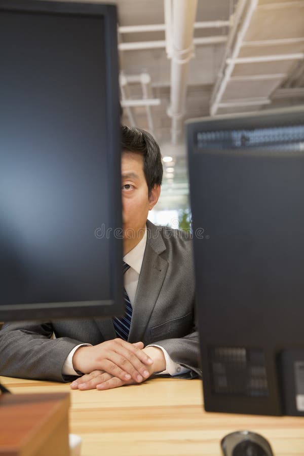 Businessman Looking at Computer in the Office Stock Image - Image of ...