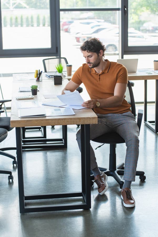 Businessman Looking at Documents on Working Stock Image - Image of ...