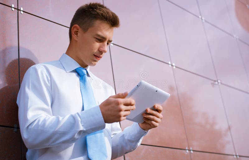 Businessman Looking Down at Tablet Computer Stock Image - Image of ...