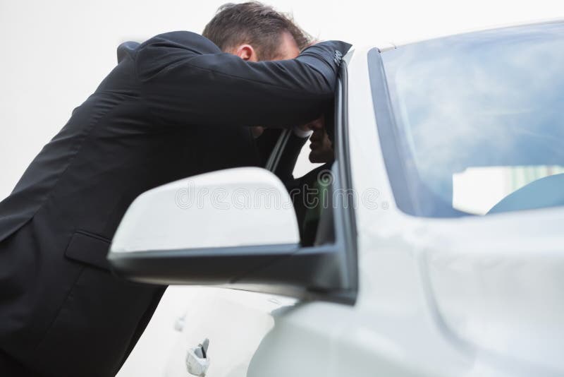 Man looking inside a car stock photo. Image of looking - 49243484