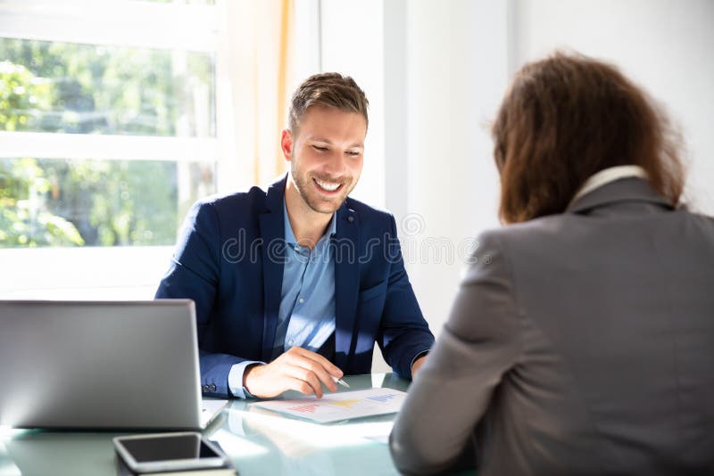 Businessman Looking at Job Candidate Stock Photo - Image of graph ...