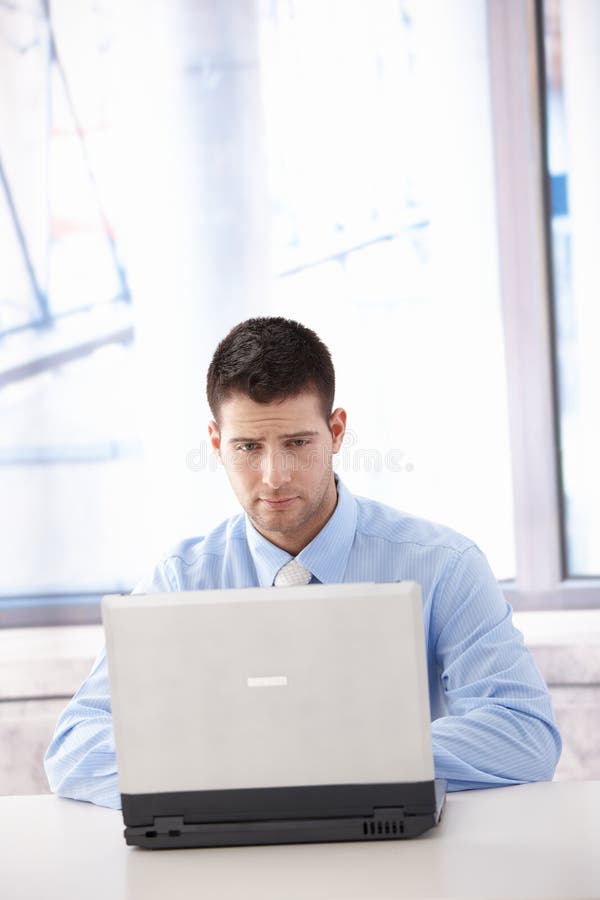 Businessman Looking at Laptop Screen Troubled Stock Image - Image of ...