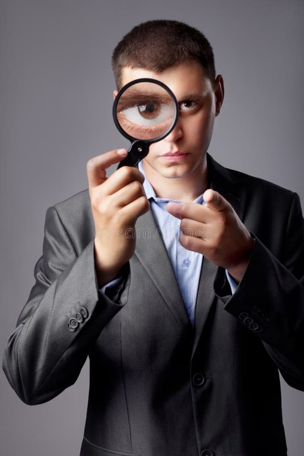 Detective Looking through Magnifying Glass Stock Photo - Image of human ...