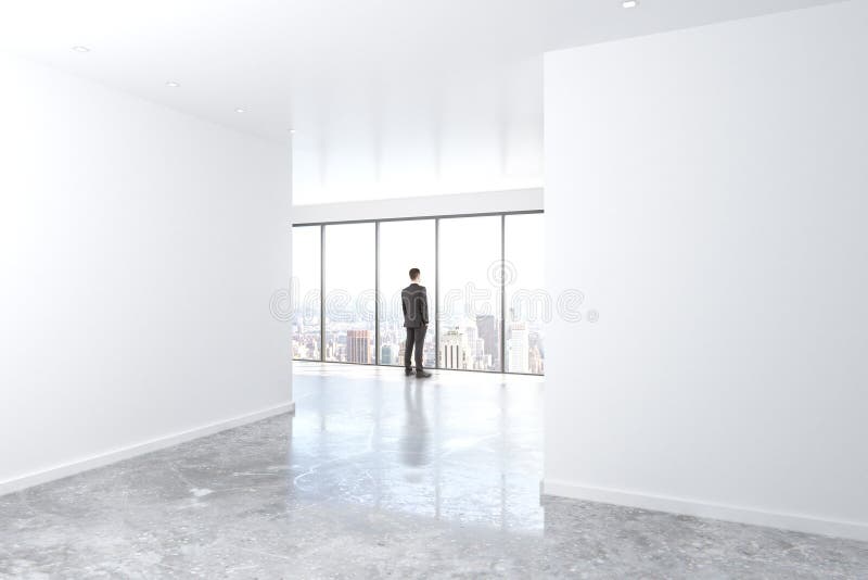 Businessman Looking Out the Window in Empty Office with Concrete Stock ...