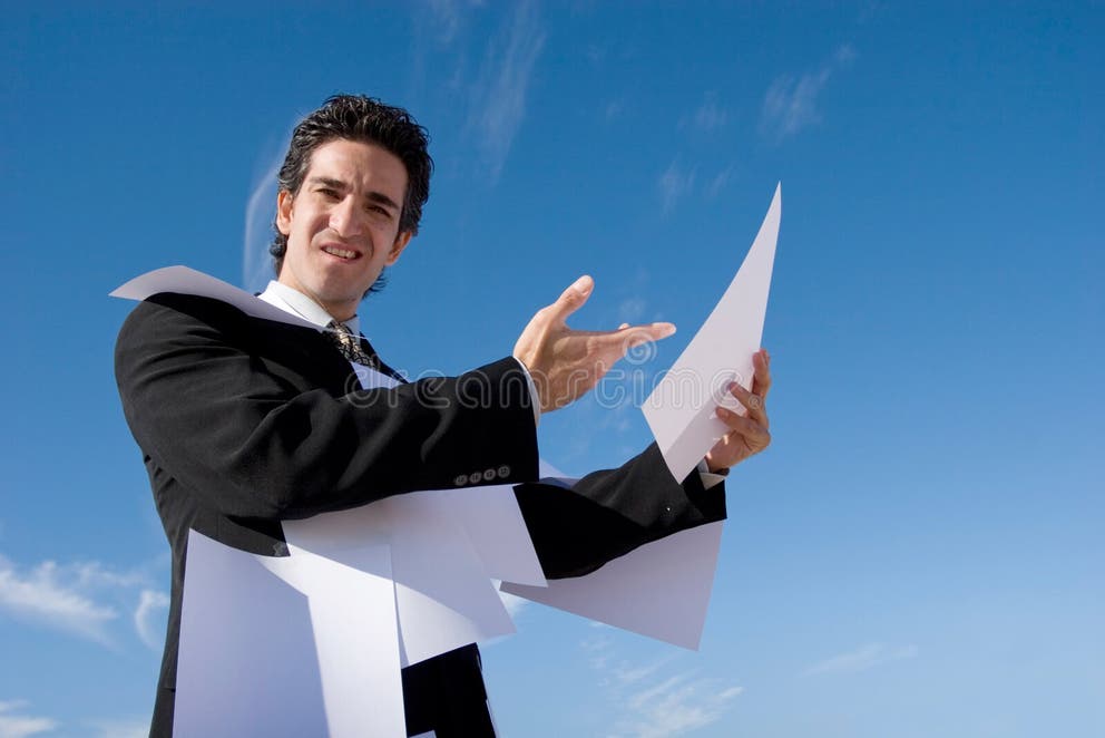 Businessman Looking Over Paperwork Stock Photo - Image of paperwork ...