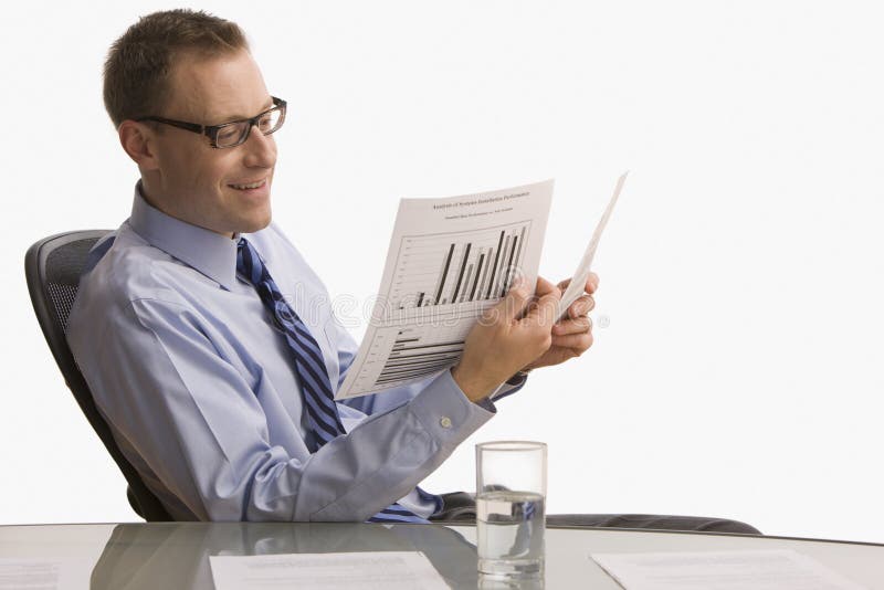 Businessman Looking at Paperwork - Isolated Stock Photo - Image of ...