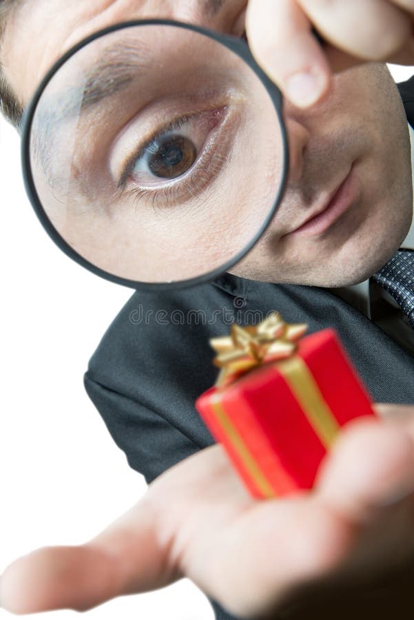 Businessman Looking at a Small Present Stock Image - Image of person ...