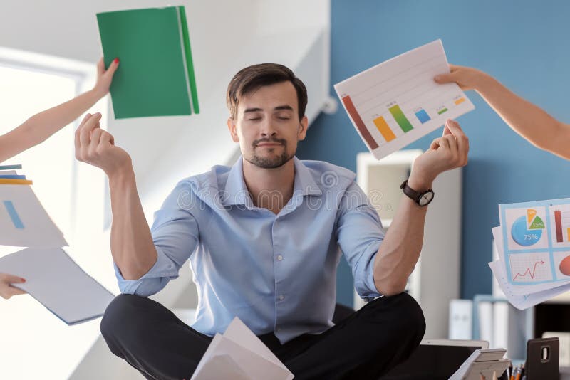 Businessman with a Lot of Work To Do Meditating in Office Stock Photo ...