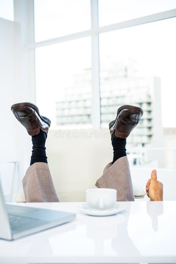 Businessman Lying on the Ground with Feet Up Stock Photo - Image of ...