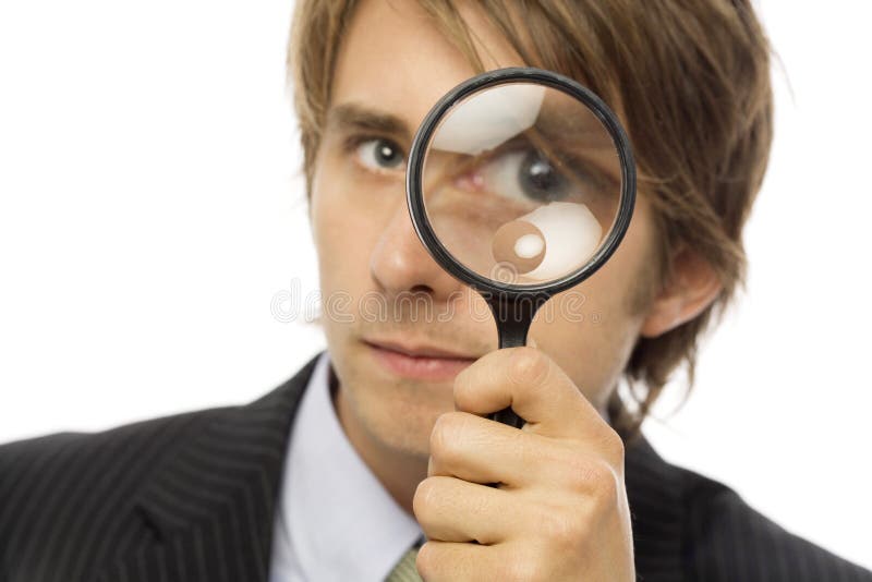 Businessman magnifies stock photo. Image of magnification - 2386206