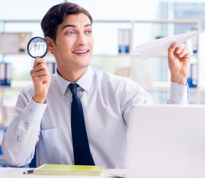 Businessman with Magnifying Glass and Paper Plane Stock Image - Image ...