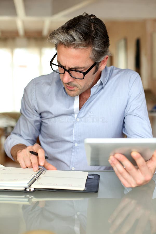 Businessman Making Appointments at Home Stock Photo - Image of ...